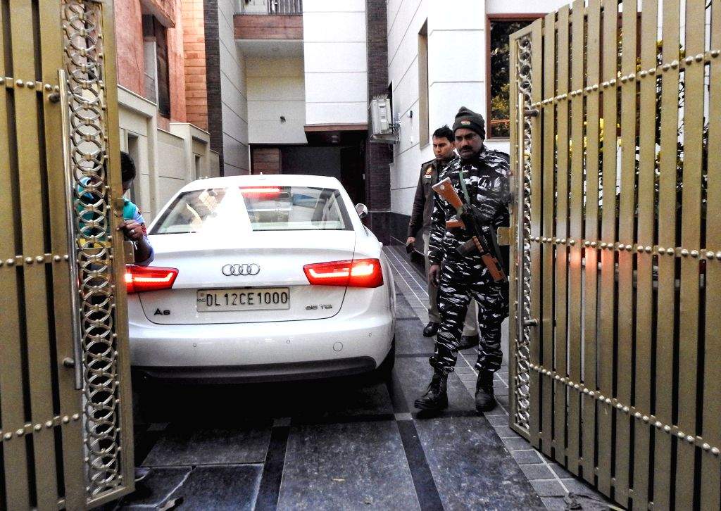 Security personnel stand guard at the residence of AAP Rajya Sabha MP ...