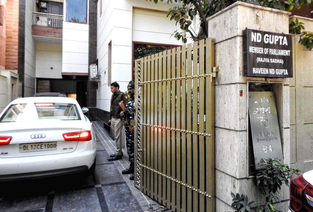 Security personnel stand guard at the residence of AAP Rajya Sabha MP ...