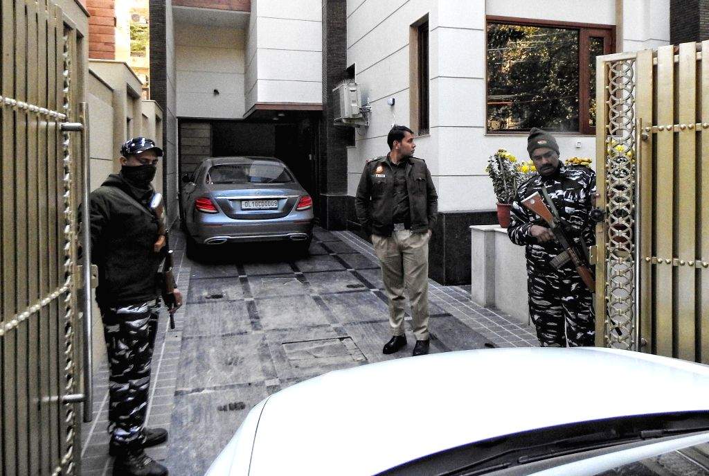 Security personnel stand guard at the residence of AAP Rajya Sabha MP ...