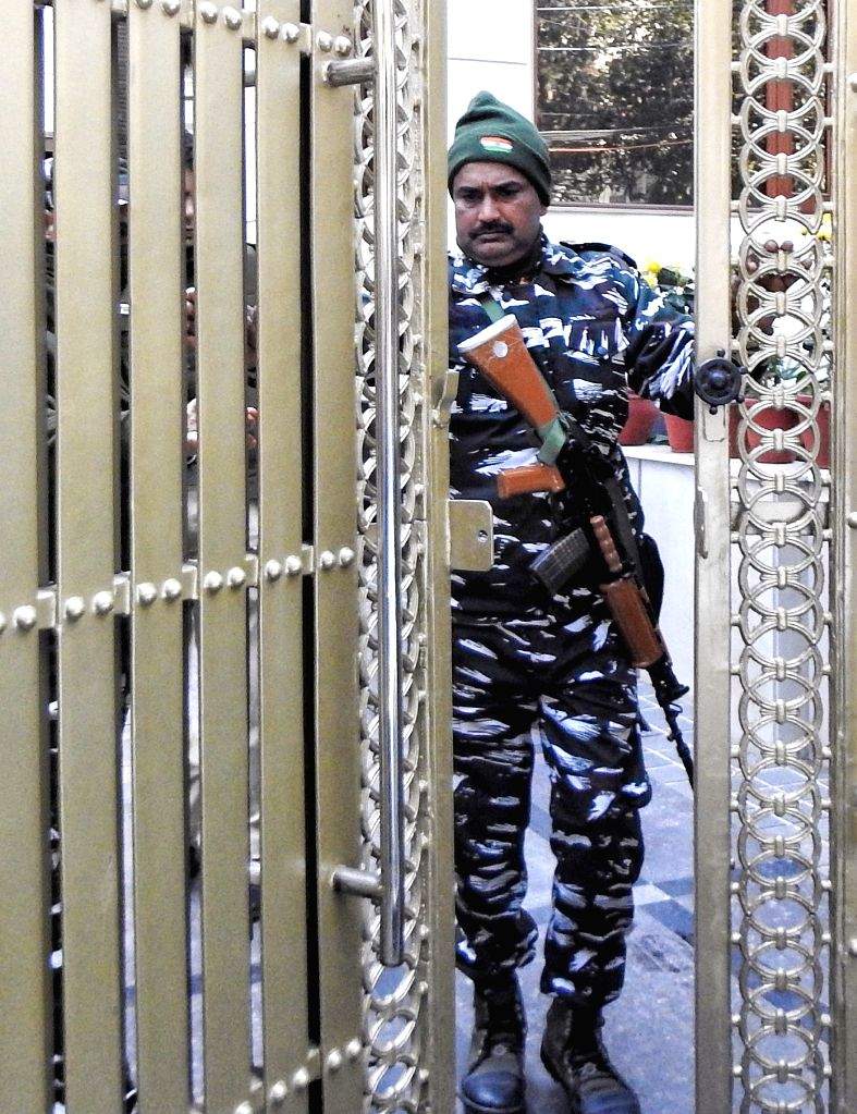 Security personnel stand guard at the residence of AAP Rajya Sabha MP ...