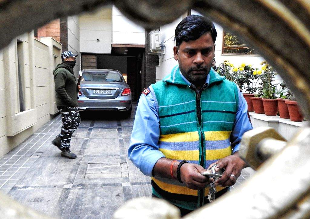 Security personnel stand guard at the residence of AAP Rajya Sabha MP ...