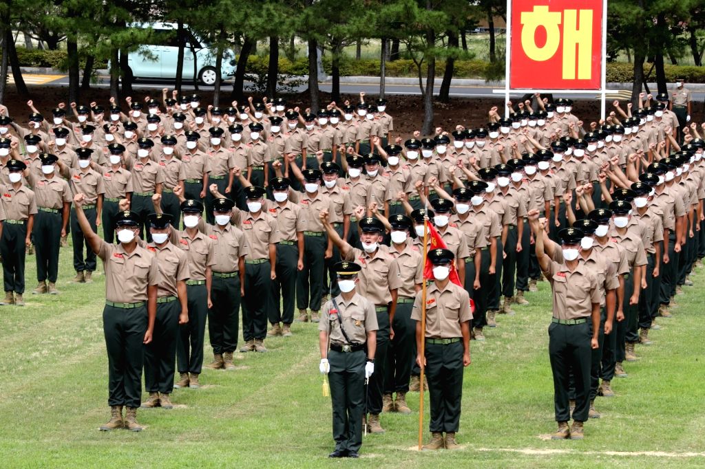 : Seoul :Recruits react during a ceremony to declare their completion ...