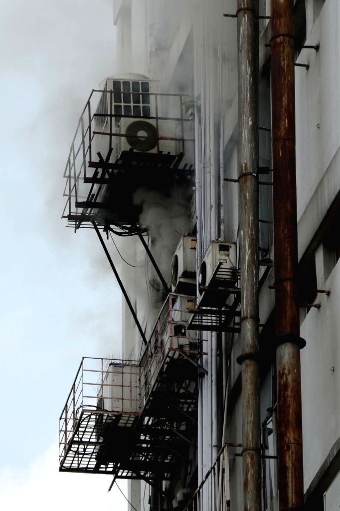 Smoke comes out from an office building after it caught fire in Kolkata.