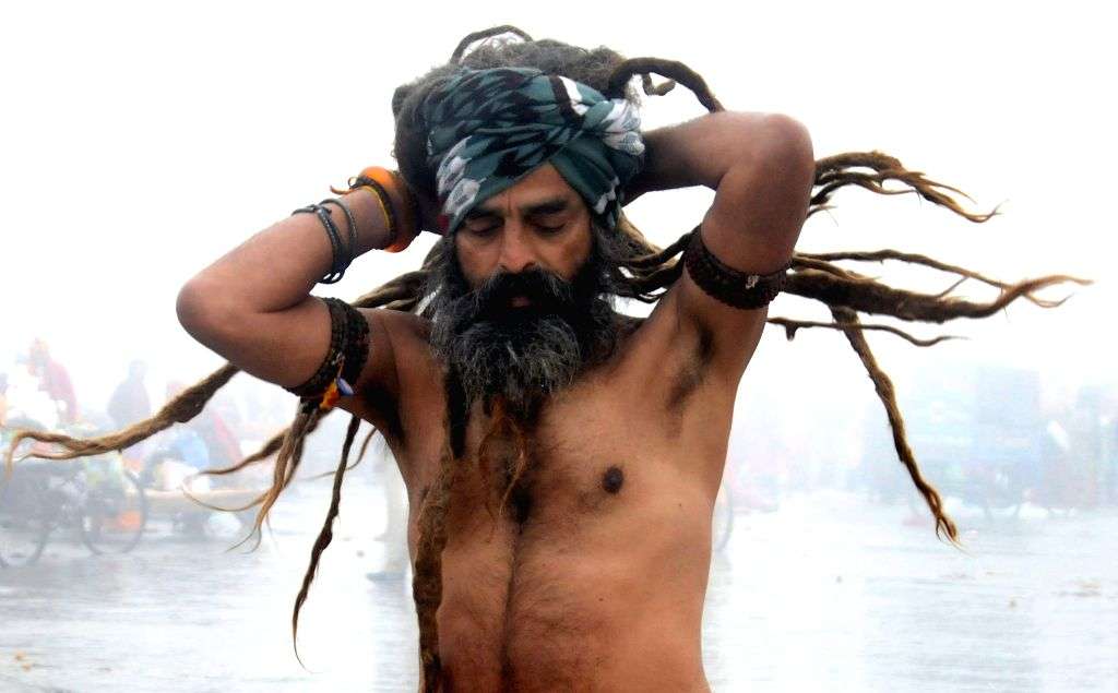 South 24 Parganas: A 'sadhu' takes a holy bath at the Sagar Island on ...