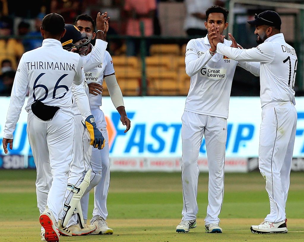 :Bengaluru:Sri Lanka's Praveen Jayawickrama, celebrates with teammates ...