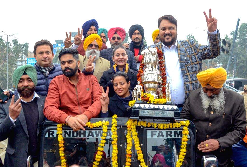 Staff and students celebrate as the Maulana Abdul Kalam Azad Trophy ...