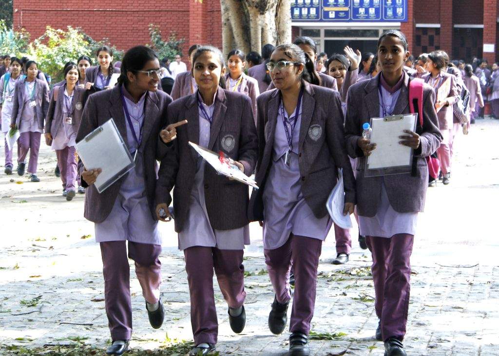 Students are seen discussing after appearing in the 10th and 12th CBSE ...