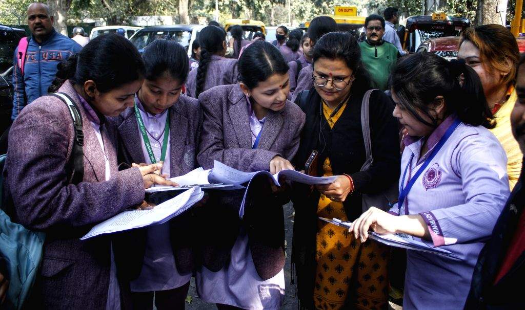 Students are seen discussing after appearing in the 10th and 12th CBSE ...