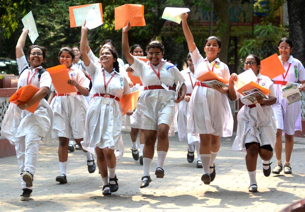 Students celebrate after the WBBSE class 10th examination results were ...