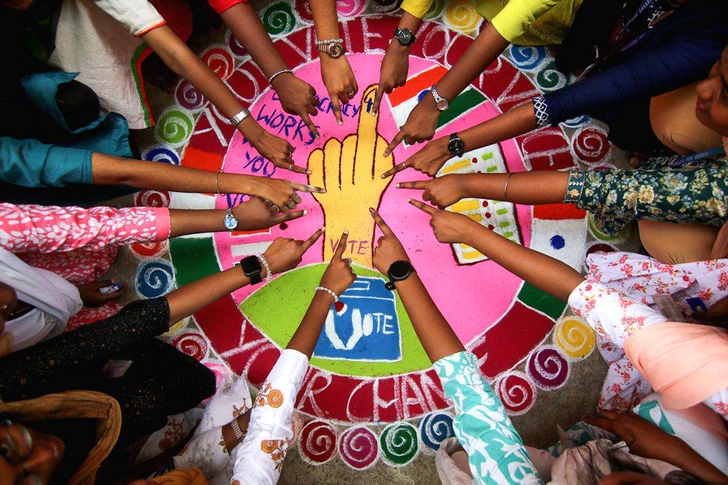 Students create rangoli to promote full voting in Chennai