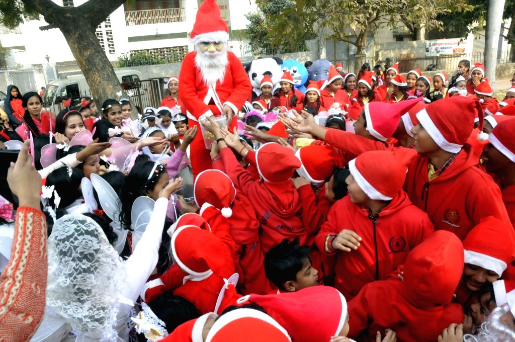 Students dressed as Santa Claus during celebrations for the Christmas ...
