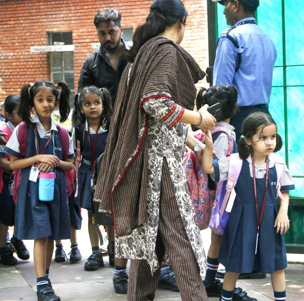 Students leave after attending the first day as schools reopen ...