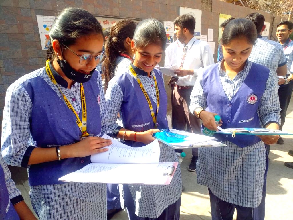 Students of class 12th discuss the question paper with each other
