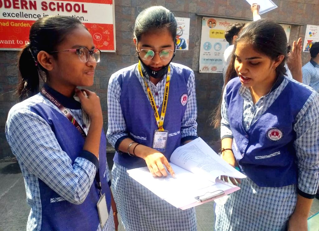 Students of class 12th discuss the question paper with each other