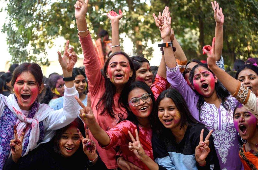 Students of Magadh Mahila College play with colours during the ...