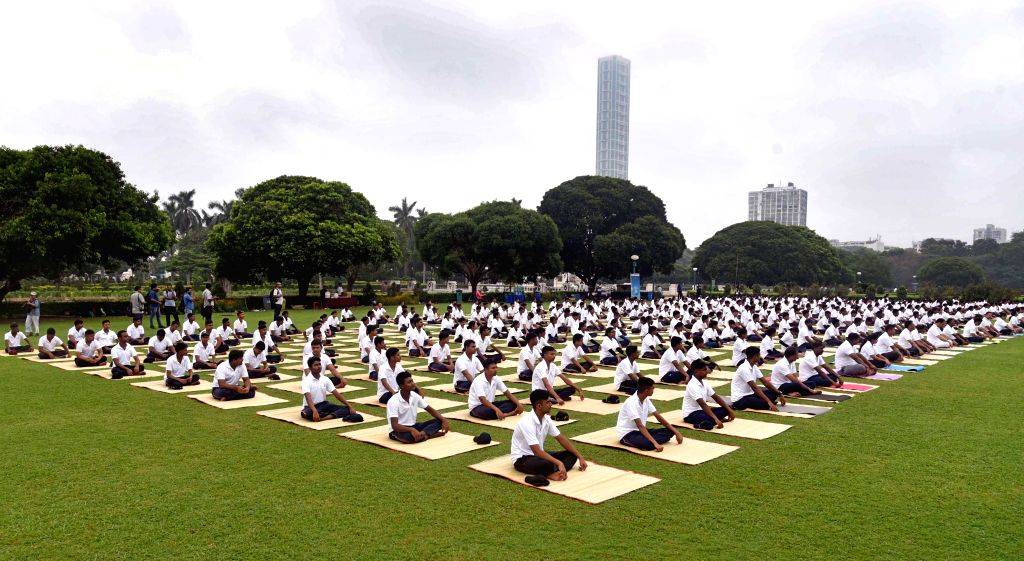 Students perform yoga on the occasion of International Day of Yoga at ...