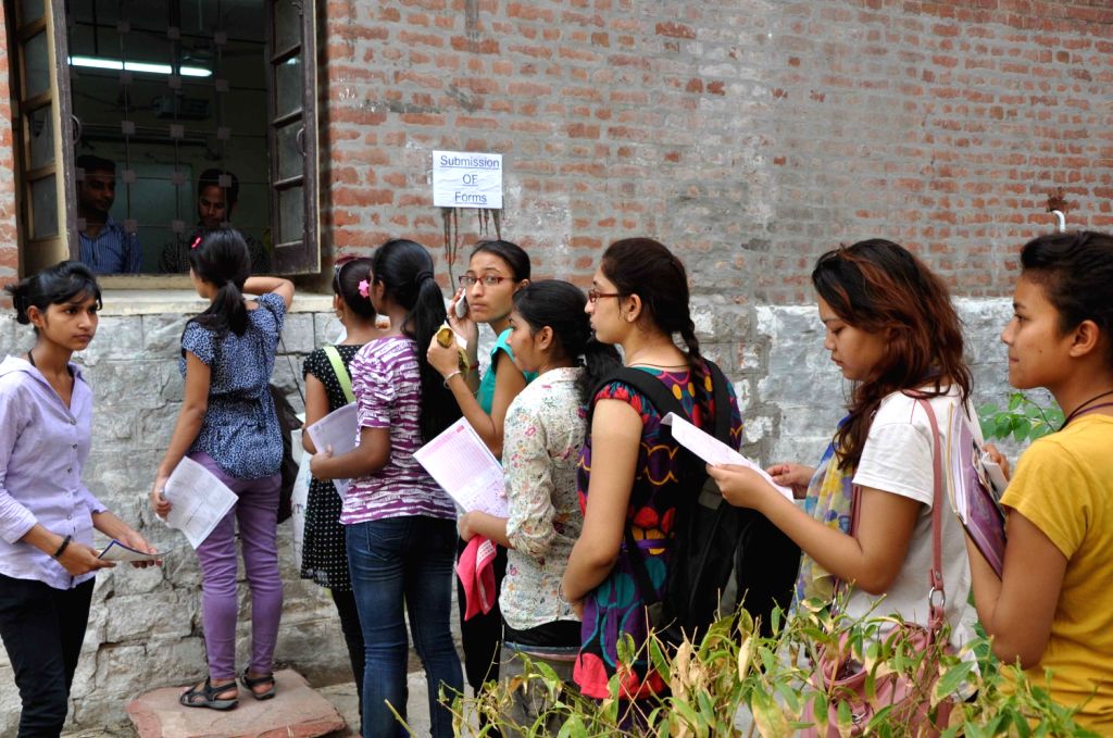 Students stand in que for admission forms at Faculty of Arts College at ...