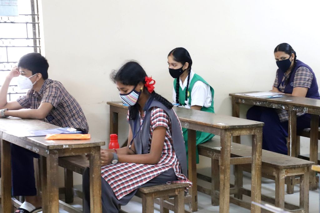 Students wearing mask as they appear for SSLC examination.
