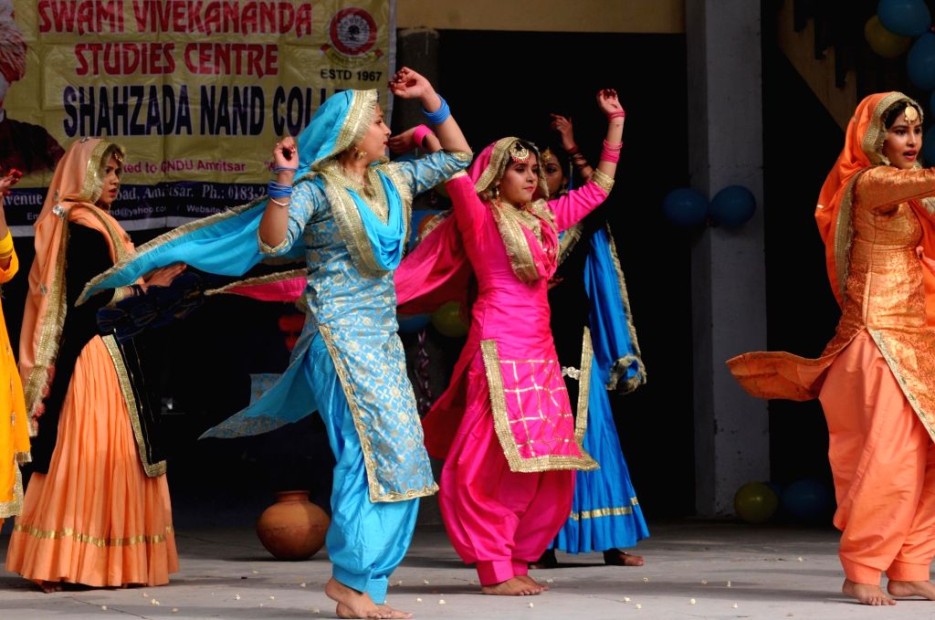 Students wearing traditional Punjabi attire, perform 'Gidha' during an ...