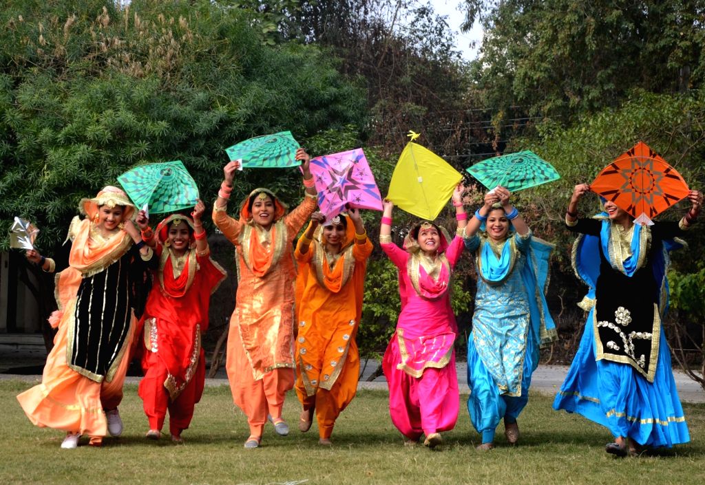 Students wearing traditional Punjabi attire, perform 'Gidha' during an ...