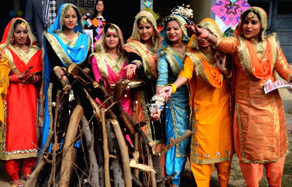 Students wearing traditional Punjabi attire, perform 'Gidha' during an ...