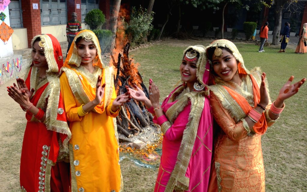 Students wearing traditional Punjabi attire, perform 'Gidha' during an ...