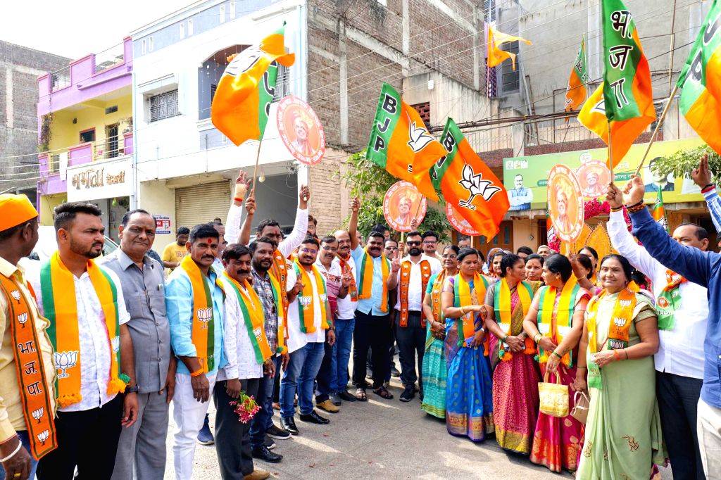 Supporters of BJP leader Devendra Fadnavis celebrate after he was ...