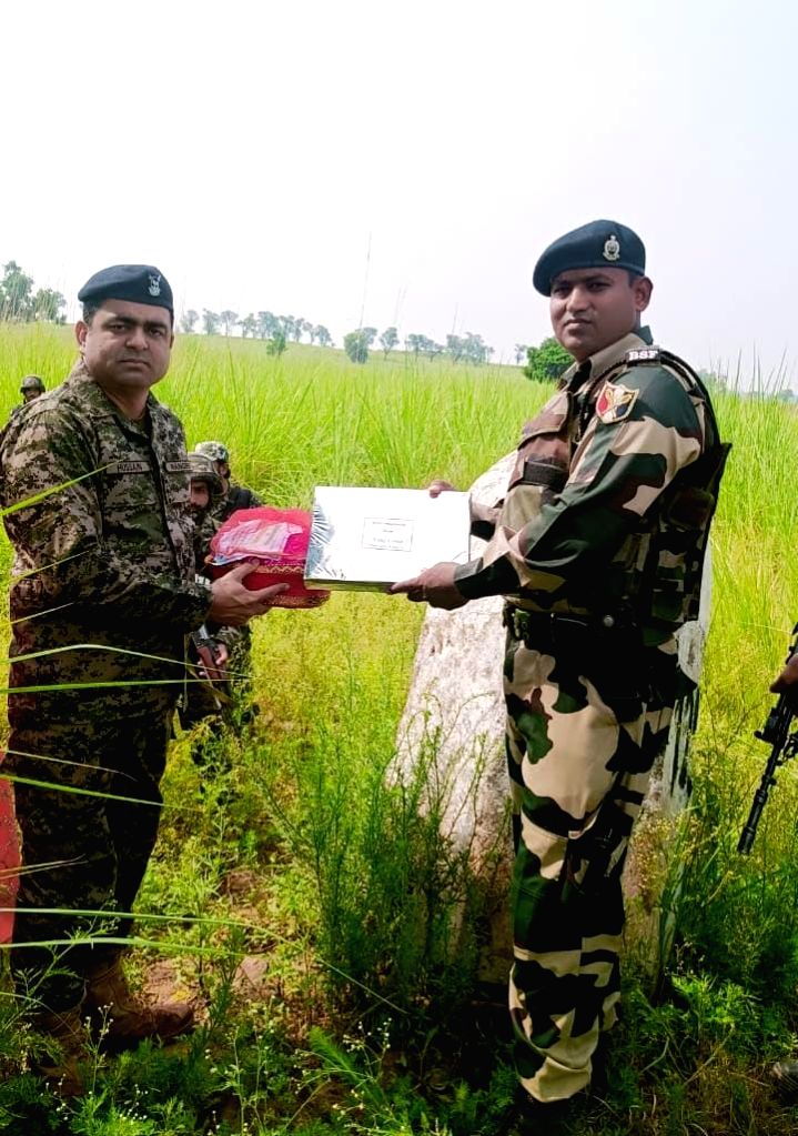 Sweets exchanged by BSF, Pakistan Rangers on Jammu border on Eid