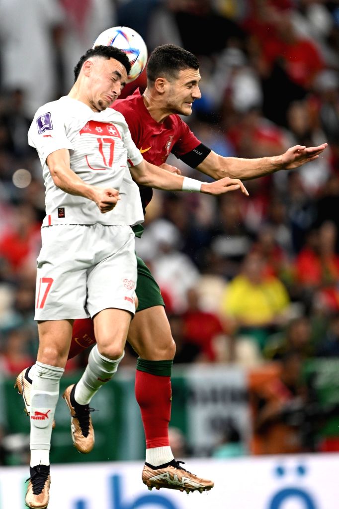 :Lusail:Switzerland's Ricardo Rodriguez battle for the ball.