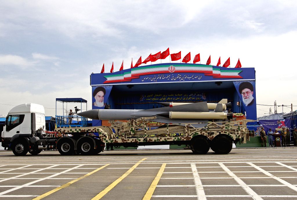 An Iranian military vehicle carrying a missile takes part in the Army ...