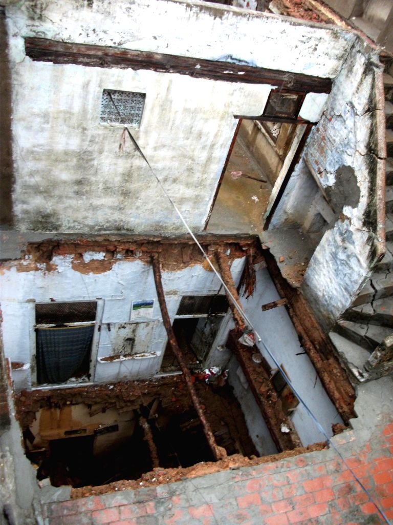 One killed as building roof caves in