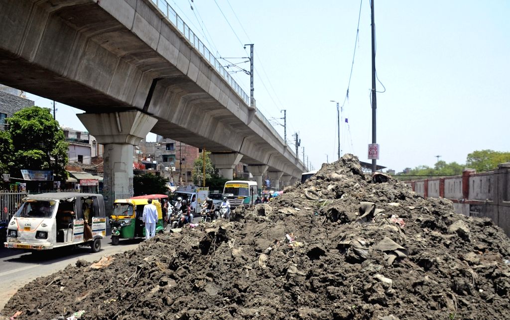 New Delhi : Ahead of the monsoon season, the desilting of colony drains ...