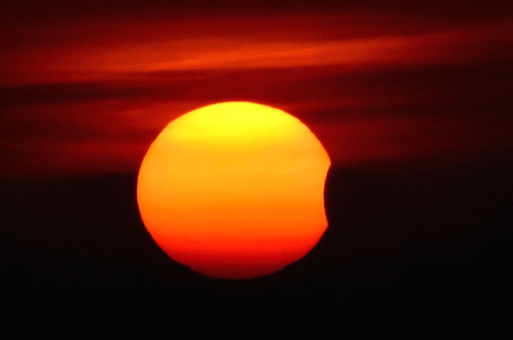The moon partially covers the sun during the partial solar eclipse