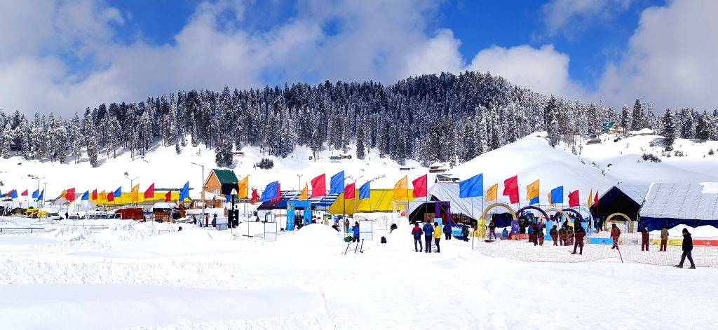 Tourists visit snow laden mountain after fresh snowfall in higher reaches