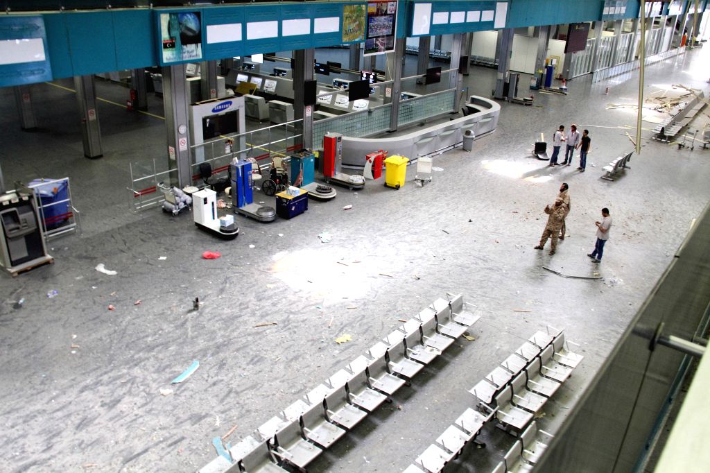 Militias patrol in the terminal of Tripoli International Airport, in Libya