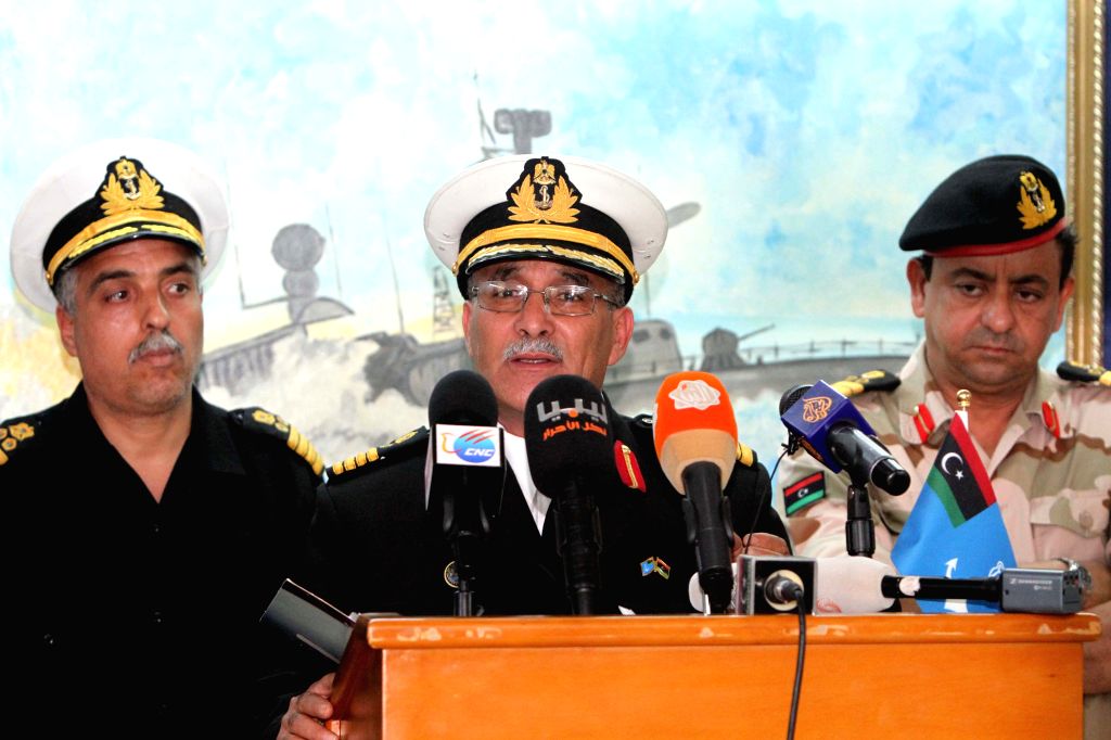 An officer from Libyan Navy addresses at a news conference in Tripoli