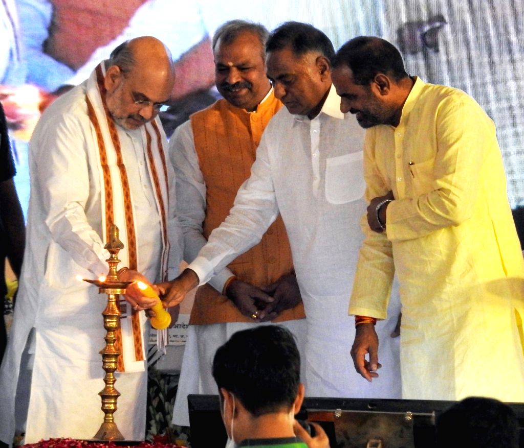 Union Home Minister Amit Shah lights a lamp