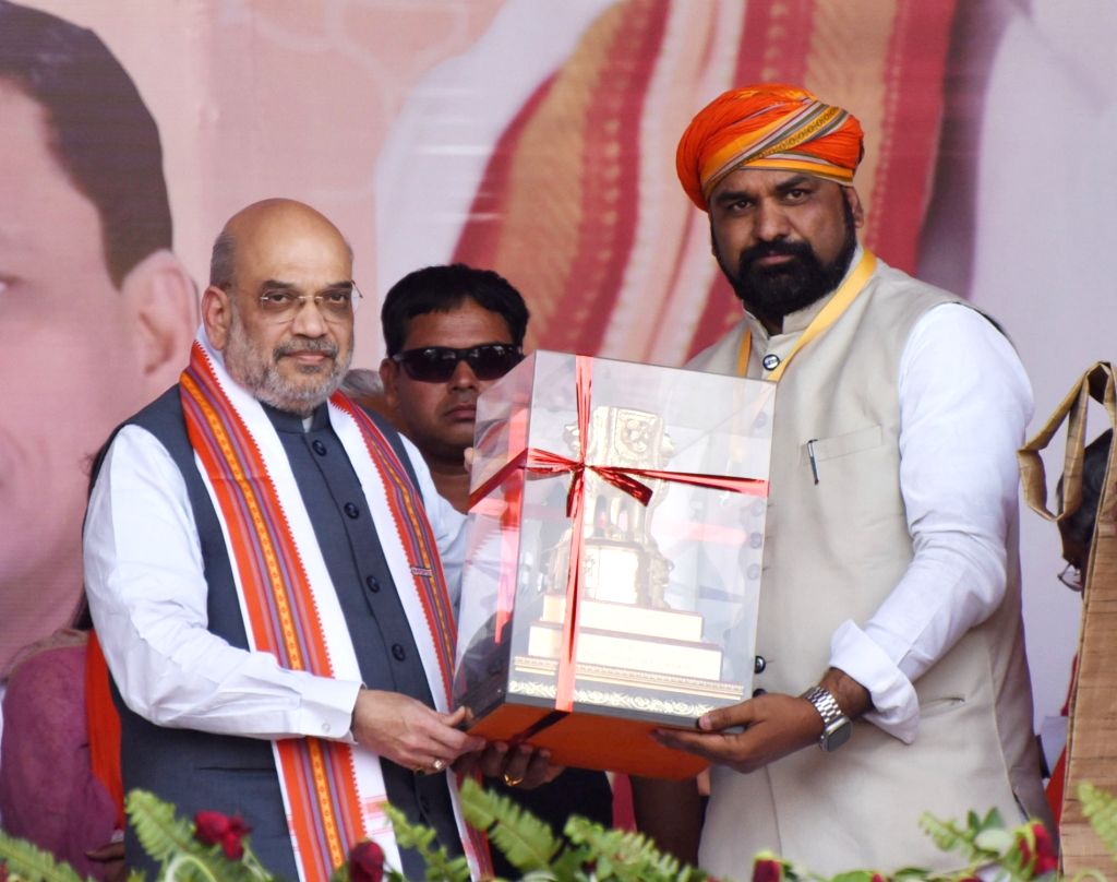 Union Home Minister Amit Shah being felicitated during a public meeting