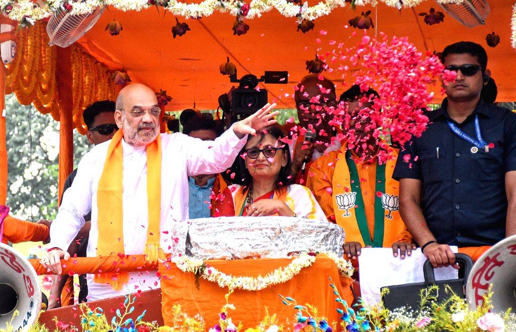 Union Home Minister Amit Shah with BJP candidate Amrita Roy during a ...