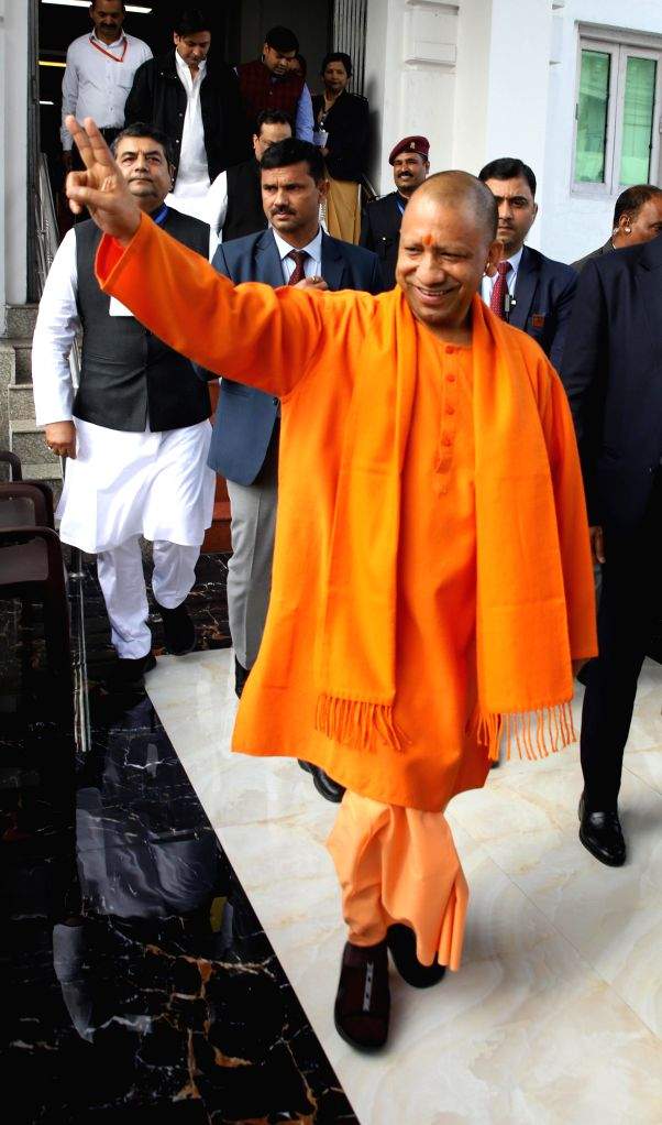 UP CM Yogi Adityanath shows victory sign after casting his vote