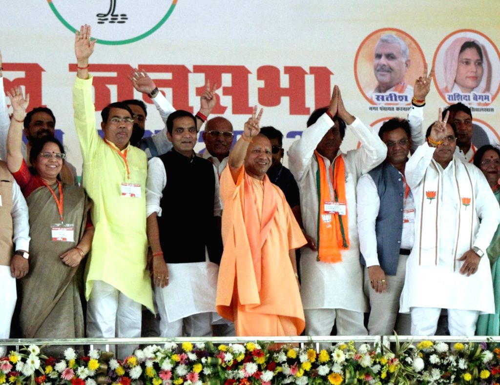 Uttar Pradesh Chief Minister Yogi Adityanath shows victory sign during ...
