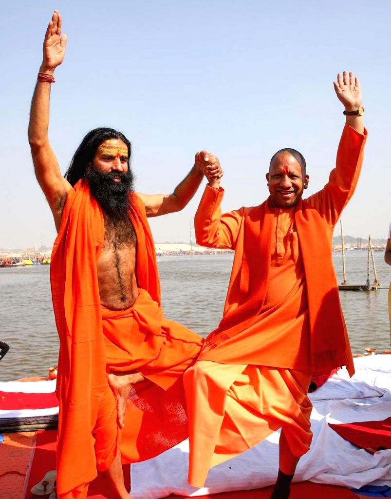 Uttar Pradesh Chief Minister Yogi Adityanath and yoga guru Ramdev ...