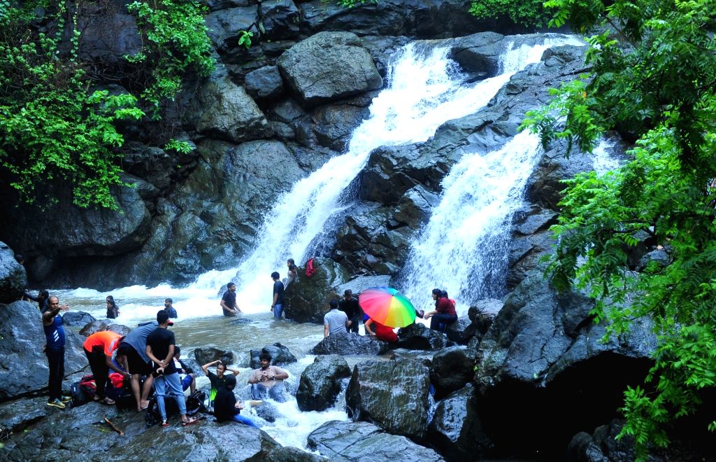 :Vasai:People enjoying the monsoon near Tungareshwar waterfall.