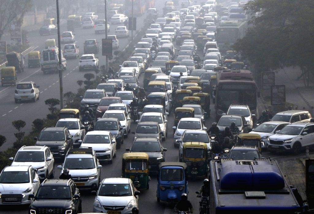 Vehicles navigate through heavy traffic amidst fog at ITO