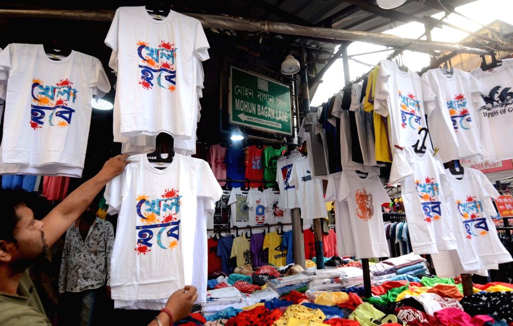 Vendors put on displays of "Khela Hobe" T-shirts ahead of Holi festival ...