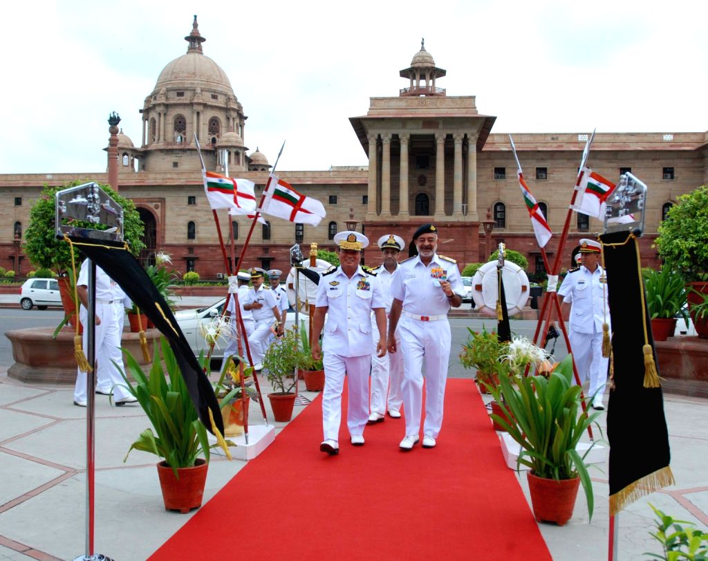Vice Admiral Thura Thet Swe being received by D K Joshi for a meeting