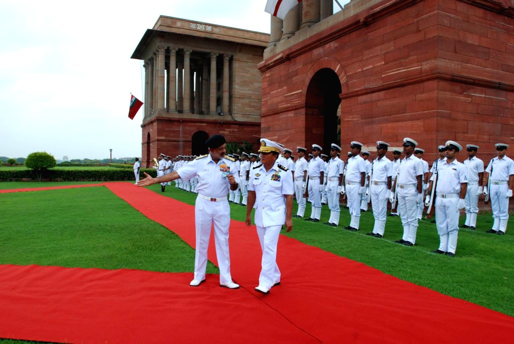 Vice Admiral Thura Thet Swe being received by D K Joshi for a meeting
