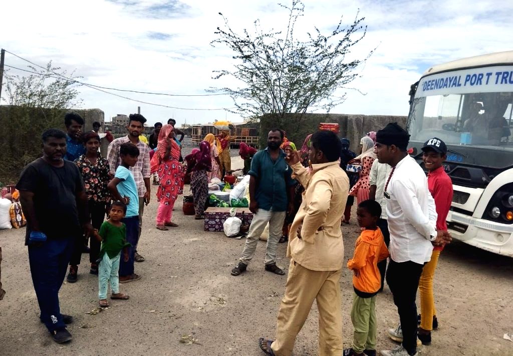 Villagers wait for transport for evacuation at Jakhau village ahead of ...