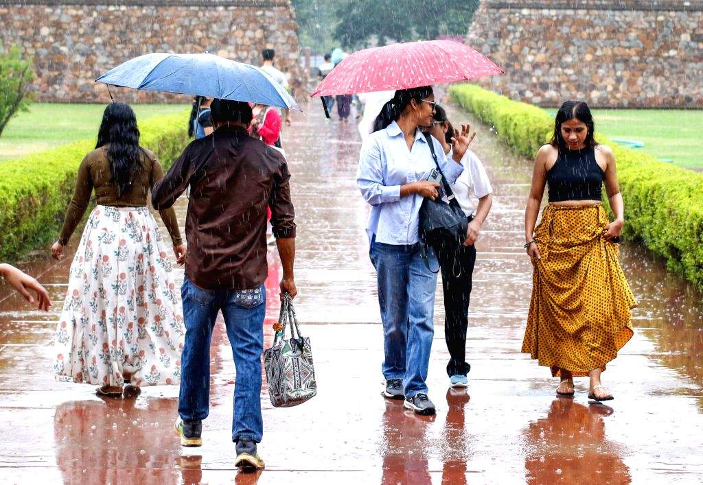 Visitors enjoy rain at Humayun’s Tomb