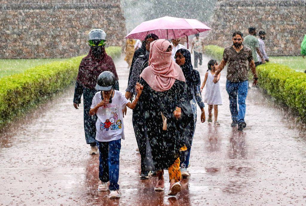 Visitors enjoy rain at Humayun’s Tomb